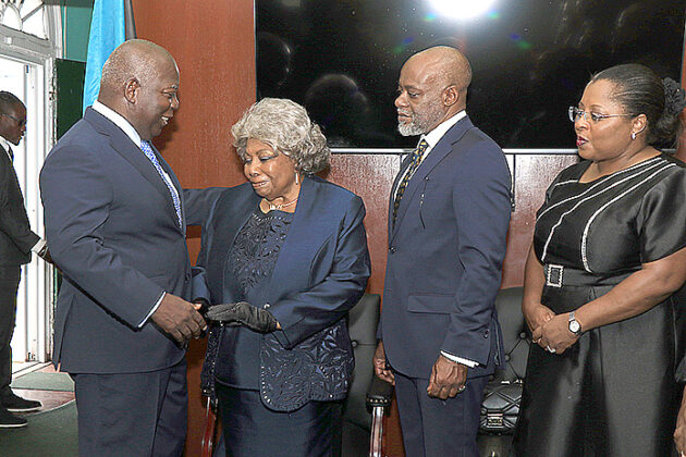 Prime Minister Davis pays respects at the Lie-in-State of the late ...